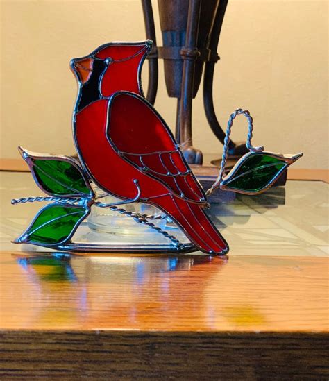 3 dimensional cardinal votive stained glass cardinal on a branch