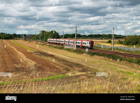 Transport For Wales Class 197 Diesel Commuter Train Passing Through