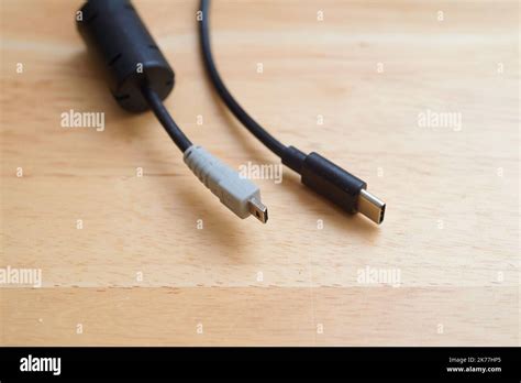 Several Charging Cables Lying On A Table Including Usb A And Usb C And Av Cable Stock Photo