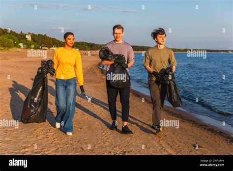 Earth Day Volunteers Activists Team Collects Garbage Cleaning Of Beach Coastal Zone Woman Mans