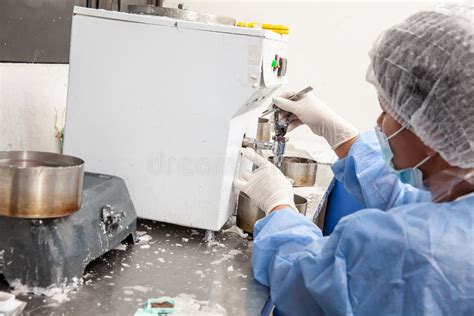 Scientist Embedding Tissues In Paraffin Blocks For Sectioning Pathology Laboratory Stock Image