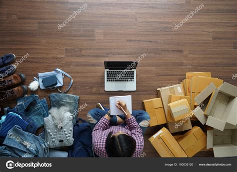 Top View Of Women Write A Notebook From Home On Wooden Floor Stock Photo Koydesign