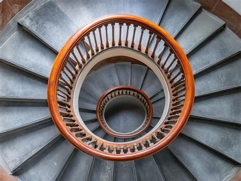 Spiral Staircase Leading Downward Symbolizing Introspection Premium Ai Generated Image