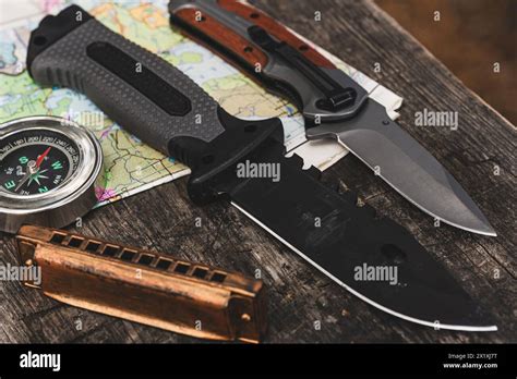 Map Area Hunting Knives And Compass Wooden Background Concept Of