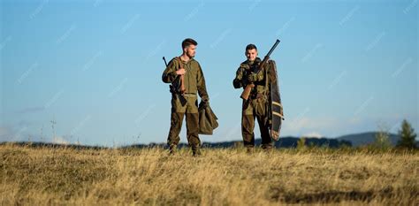 Premium Photo Man Hunters With Rifle Gun Boot Camp Hunting Skills And
