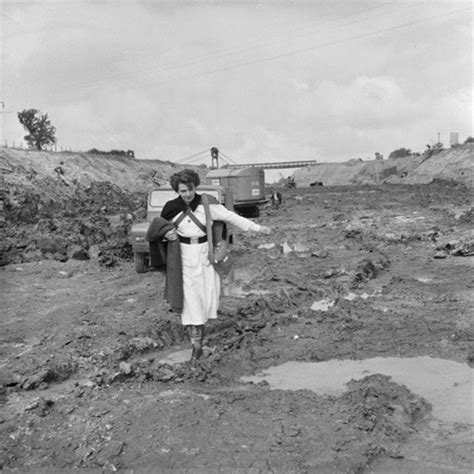Site Nurse Betty Mitchell Wading Through Mud On Section B Of The London