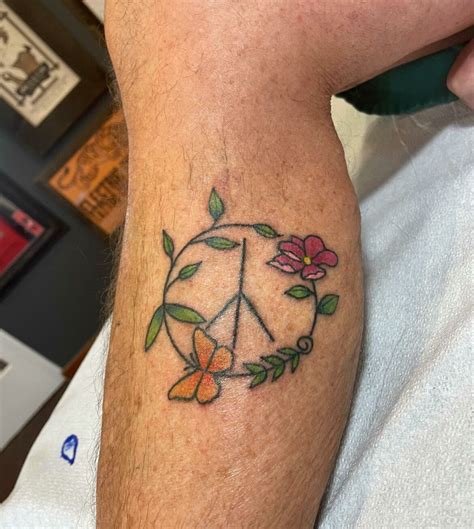 Peace Sign Tattoo Meaning Design And Style Guide