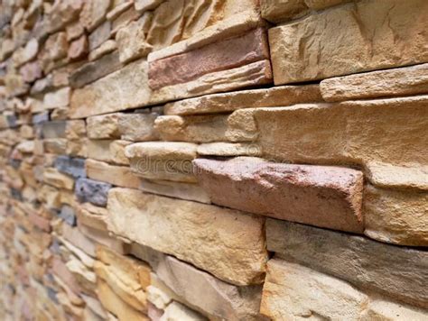 artificial stone cladding designed to resemble real stone arranged