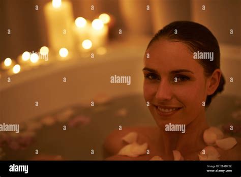 Finding Tranquility In A Rose Water Bath A Gorgeous Woman Relaxing In