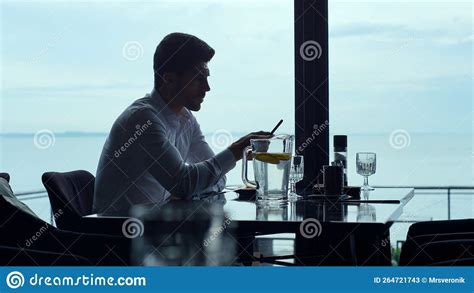 Elegant Man Scrolling Smartphone Touchscreen In Cafe Busy Lifestyle