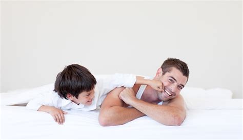 Premium Photo Laughing Father And Son Having Fun