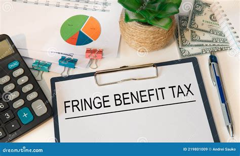 Paper With FRINGE BENEFIT TAX On The Table Calculator And Money Stock