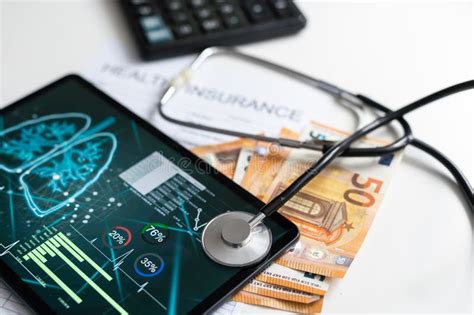Paper With Text Health Insurance On The Table With Stethoscope Stock