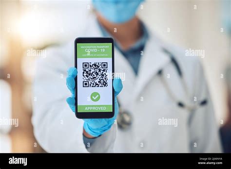 Doctor Covid Travel Vaccine Passport On Smartphone And Vaccination