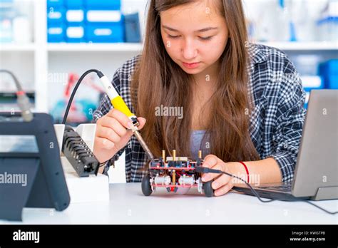 Babegirl In The Babe Robotics Laboratory With A Robot Model Stock Photo Alamy