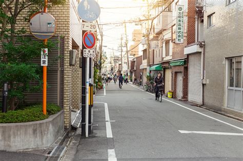 Clean Japan Street In The Morning People Are Using Bicycle Or Walking