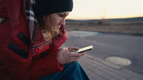 Nomophobia A Man In A Cozy Jacket Is Texting Instead Of Looking At A