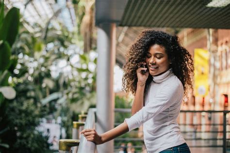 Premium Photo Gorgeous Mixed Race Girl Talking On The Phone At Public