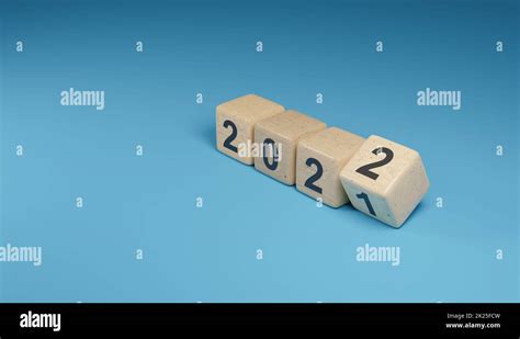 Flipping Wooden Cubes With The Year Number 2021 And 2022 New Year