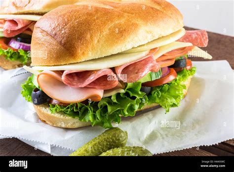 Sub Sandwich With Fresh Vegetables Lunch Meat And Cheese On Hoagie