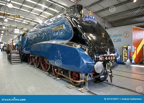 Class E464 Locomotive Hauling A Regional Train At Milano Porta