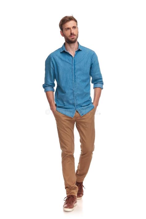 Young Casual Man Walking With Hands In Pockets Stock Image Image Of