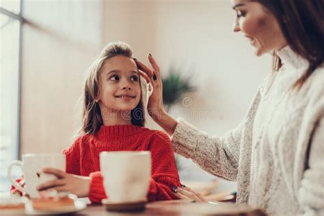 Mum Carefully Touching Hair Of Her Daughter Stock Image Image Of