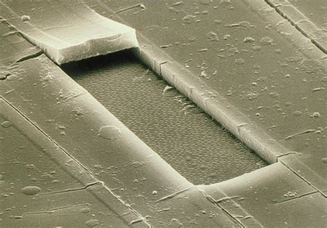 Electron Micrograph Of Compact Disc By Science Photo Library