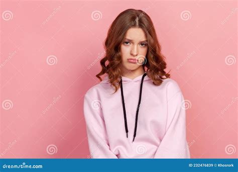Portrait Of Desperate Teenage Girl Hoodie Looking At Camera With