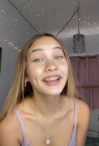Cute Halia Beamer Shows Cleavage In Purple Top