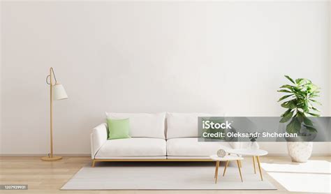 흰색 소파와 녹색 베개 현대적인 Coffe 테이블 플로어 램프 나무 바닥과 흰색 벽에 식물과 양탄자가있는 거실 인테리어 거실 인테리어 모형입니다 스칸디나비아 스타일 밝은