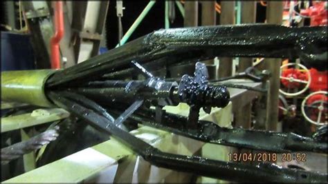 recovered production logging tool string with muck clogging spinner and