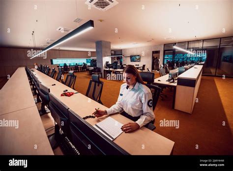 Group Of Security Data Center Operators Working In A Cctv Monitoring
