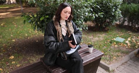 Woman Sits On Wooden Park Bench And Opens Paper Notebook Stock Footage Video Of Diary