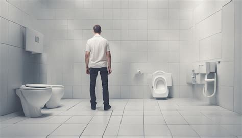 Premium Photo Man Is Standing Pee In A Toilet Healthcare Urinal Concept