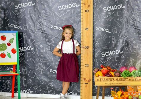 Cute Schoolgirl Girl In The Classroom Classroom Blackboard Large Ruler Table Vegetables