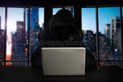 Hacker Using Computer With Digital Interface While Sitting At Desk Of