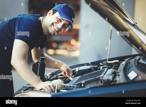 Professional car mechanic working in auto repair service Stock Photo - Alamy