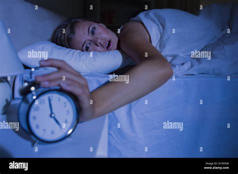 Awakening Woman Stopping Her Alarm Clock Stock Photo Alamy