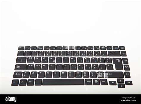 high angle view of a qwerty alphanumeric computer keyboard with black
