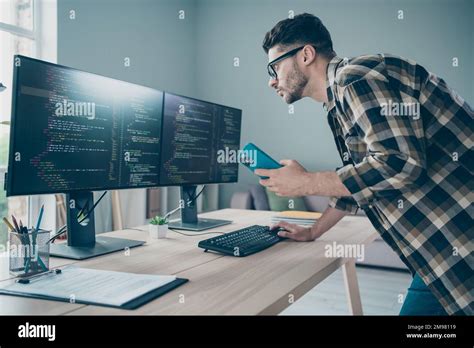 Photo Of Serious Busy Coder Dressed Eyewear Working Office Ordering Food Modern Gadget Indoors