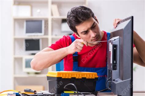 Professional Repair Engineer Repairing Broken Tv Photo Background And