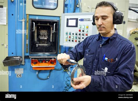 Worker Measuring With Caliper Locking Nut Transfer Machining Machined Indecober Machining Of