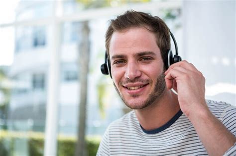 Premium Photo Handsome Man Working With Headset In A Bright Office