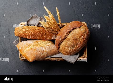 Assorted Bread Varieties In A Charming Basket Ready To Be Enjoyed