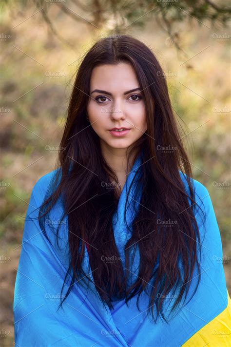 Beautiful Brunette Model Posing In A Park With Flag Of Ukraine