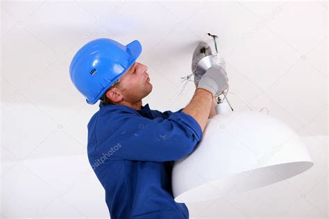 Electrician Fitting A Ceiling Light Stock Photo Photography