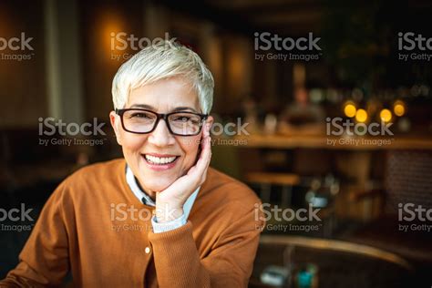 Portrait Of A Smiling Senior Woman Picture Id1149608353 Calling In