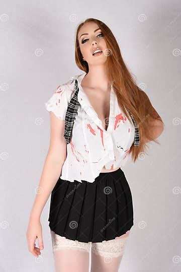 Attractive Redhead Model Dressed As A Zombie Schoolgirl For Halloween Stock Image Image Of