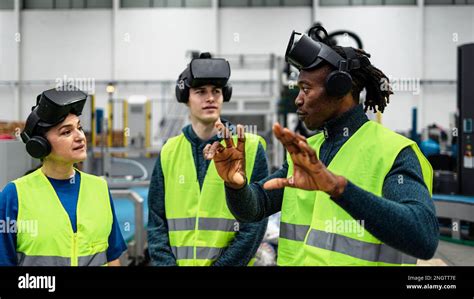 Team Of Multiracial Engineers Having A Simulation Experience With Futuristic Virtual Reality